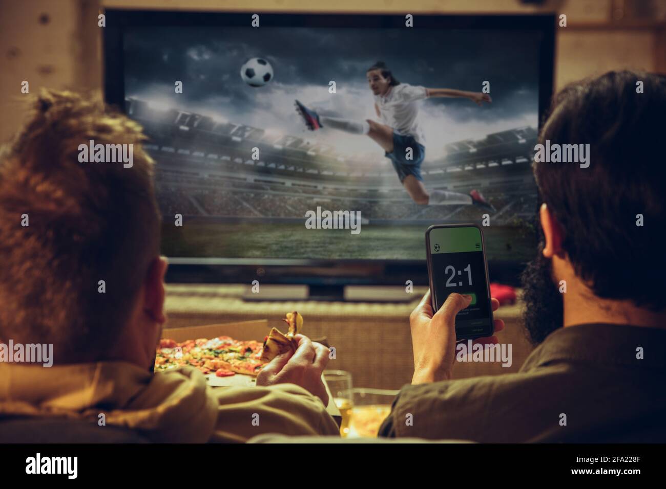 Crowd watching football match in tv hi-res stock photography and images ...