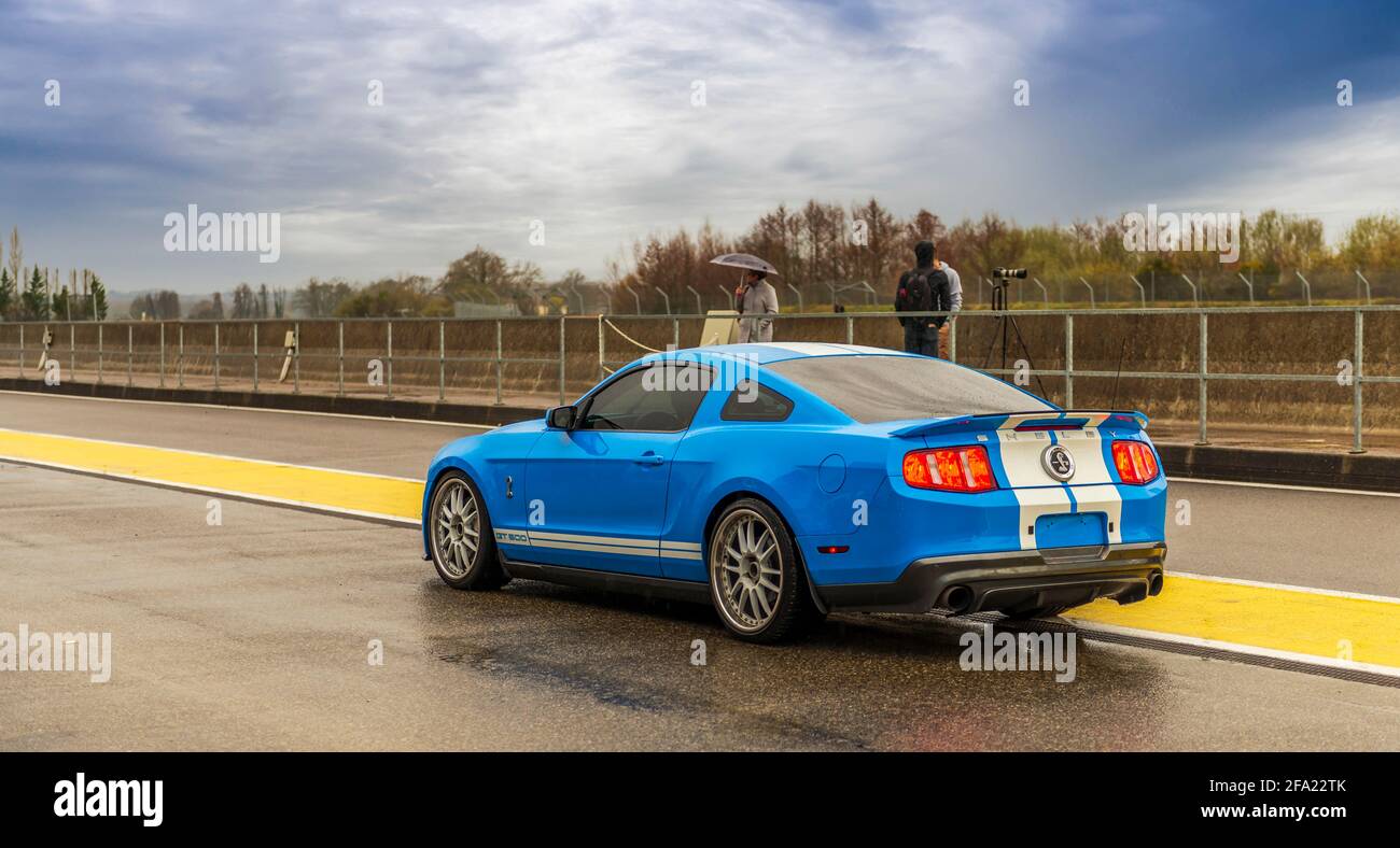 Blue racing car, on the Nogaro circuit, in the rain, in Nogaro ...