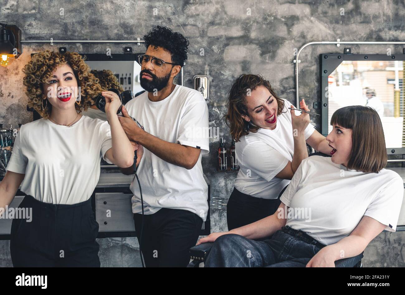 old style barbershop workers playing with tools having fun Stock Photo ...