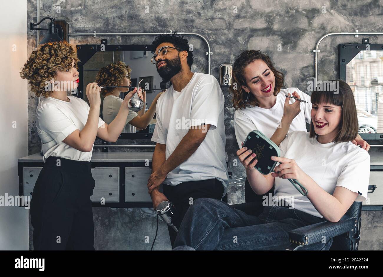 old style barbershop workers playing with tools having fun Stock Photo ...