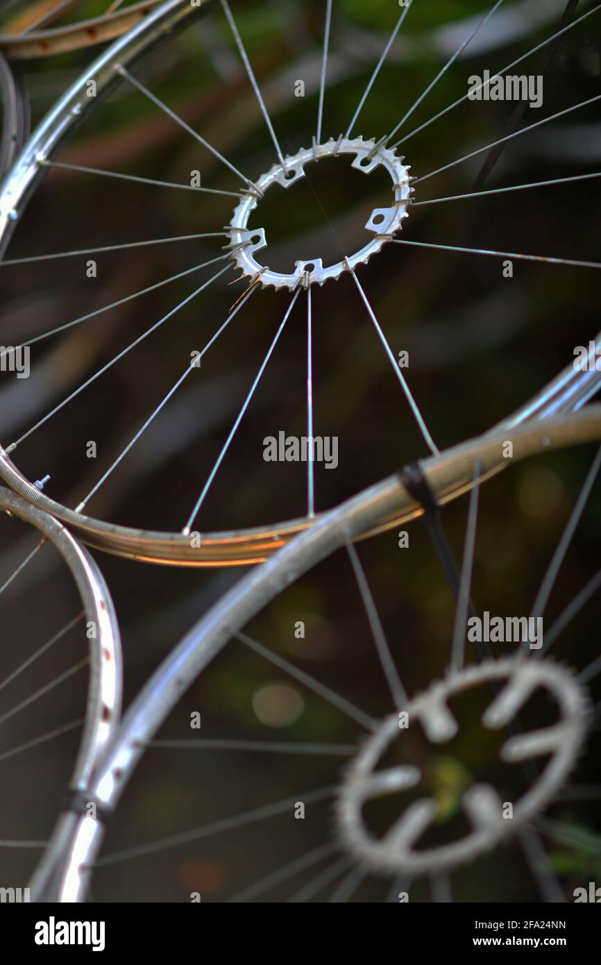 bicycle wheels and gears forming modern sculpture Stock Photo - Alamy