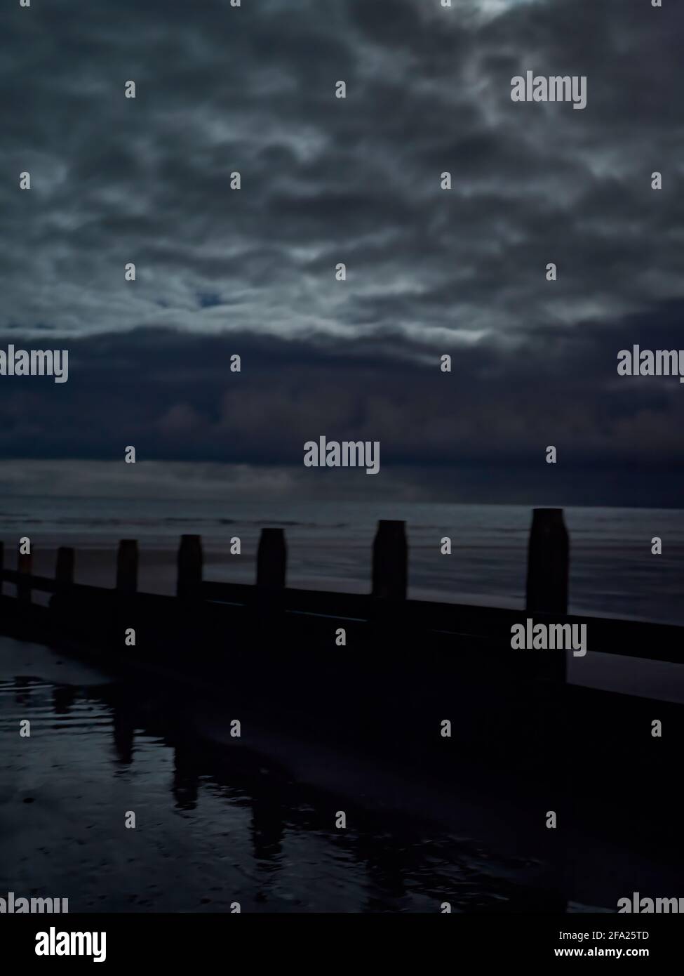 Moon hidden by coastal clouds hi-res stock photography and images - Alamy