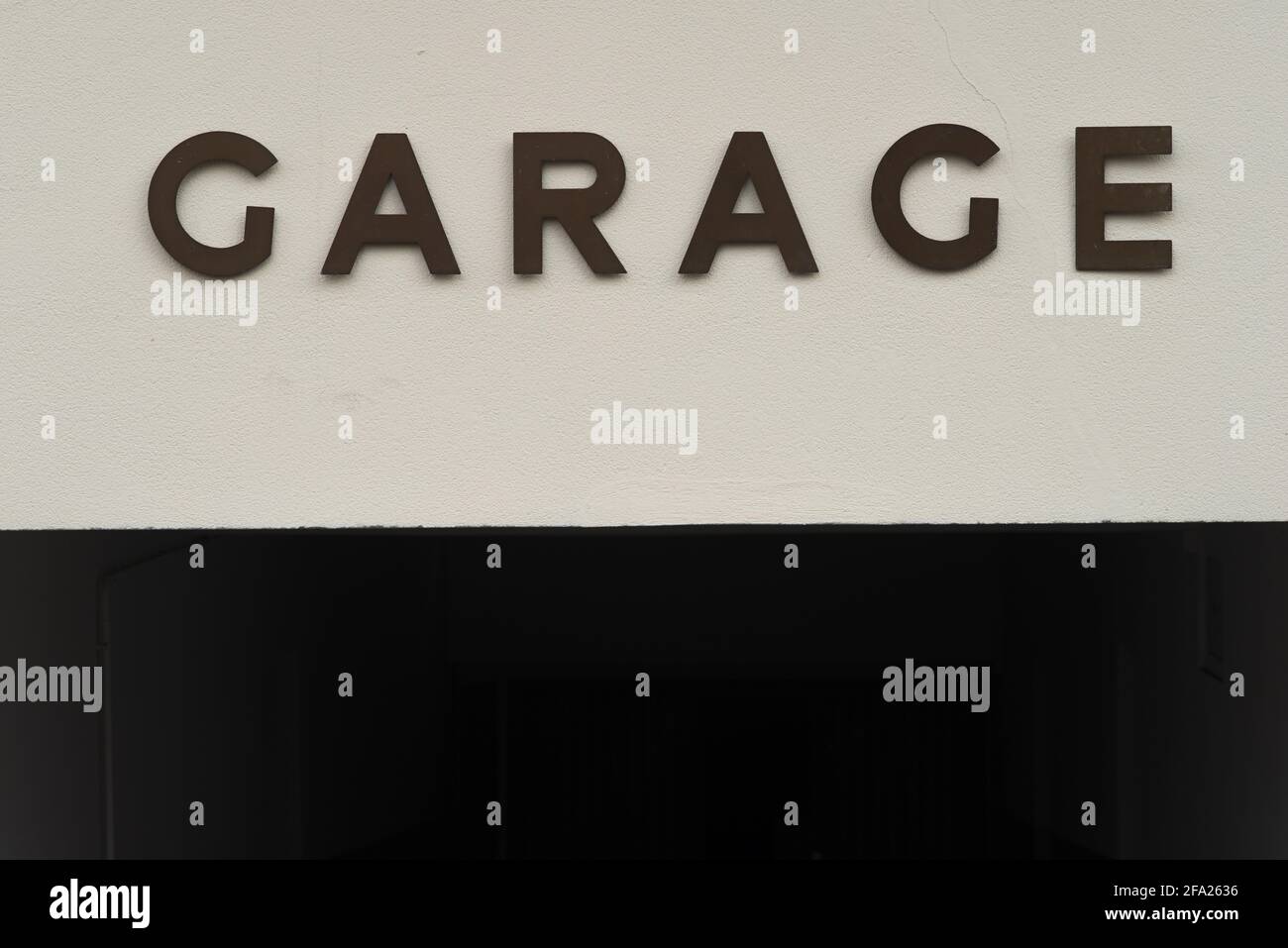 GARAGE written on a white wall Stock Photo - Alamy