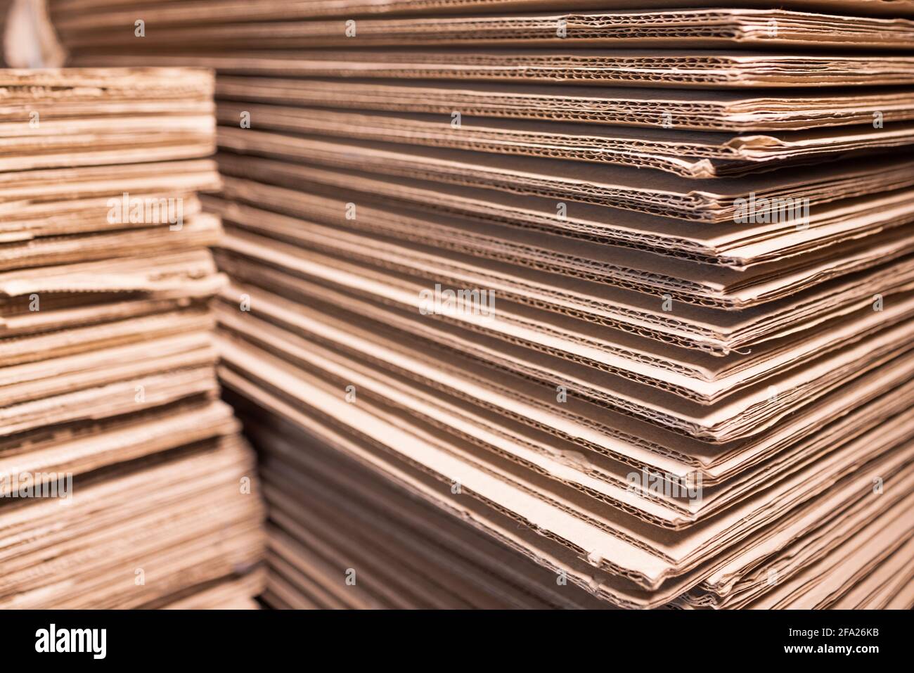 Close-up sides of stacks of cardboard folded Stock Photo - Alamy