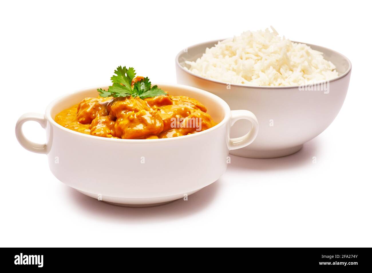 Traditional Chicken Curry and a bowl of boiled rice isolated on white ...