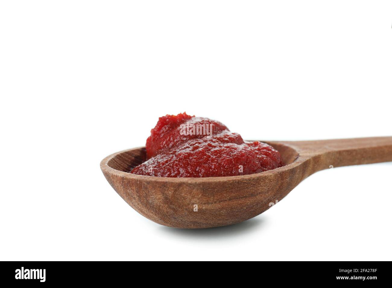 Spoon with tomato paste isolated on white background Stock Photo - Alamy