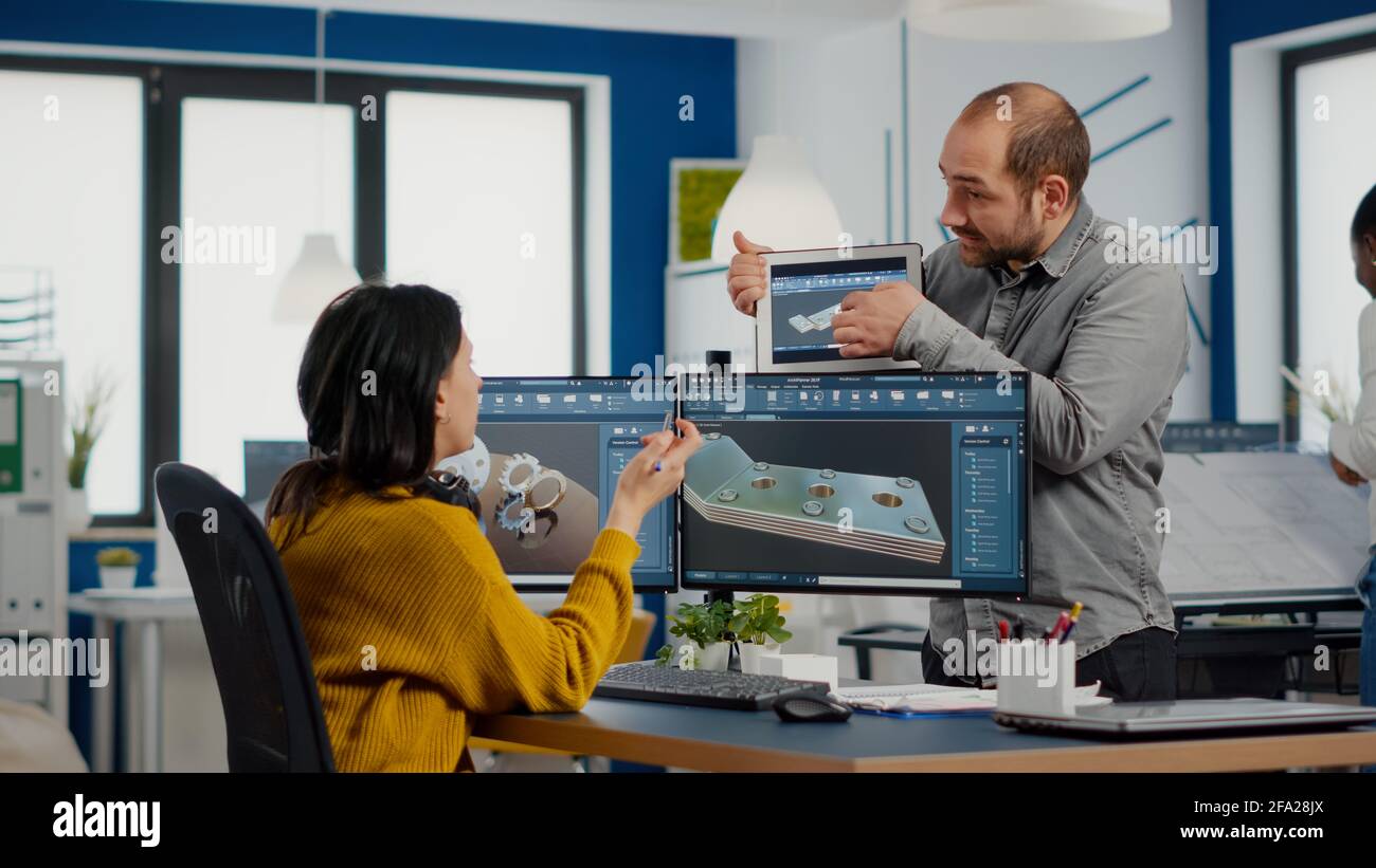 Team of architects and engineers working on building prototype project ...