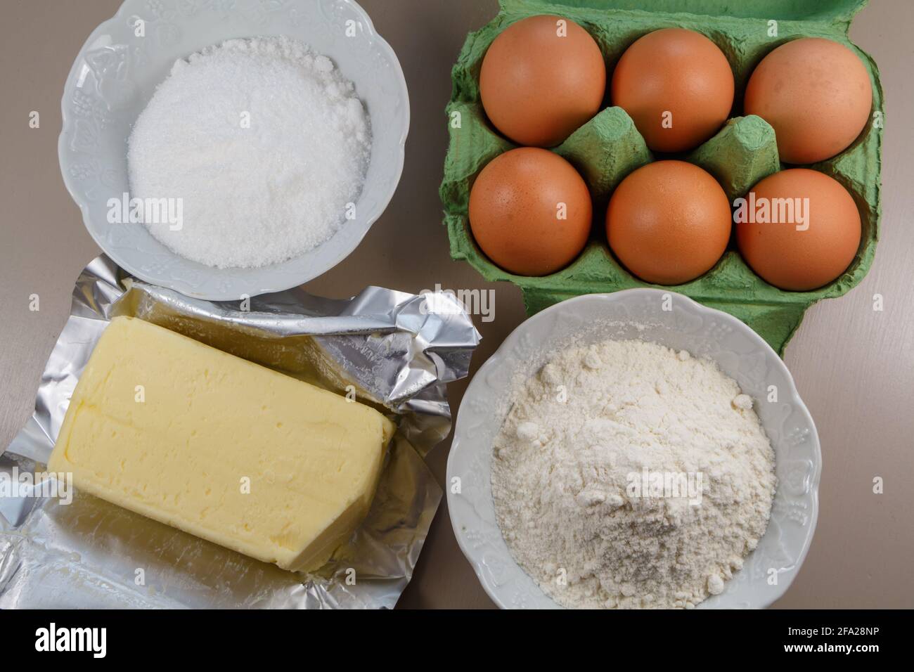 Butter, flour, sugar and eggs to make a cake Stock Photo - Alamy