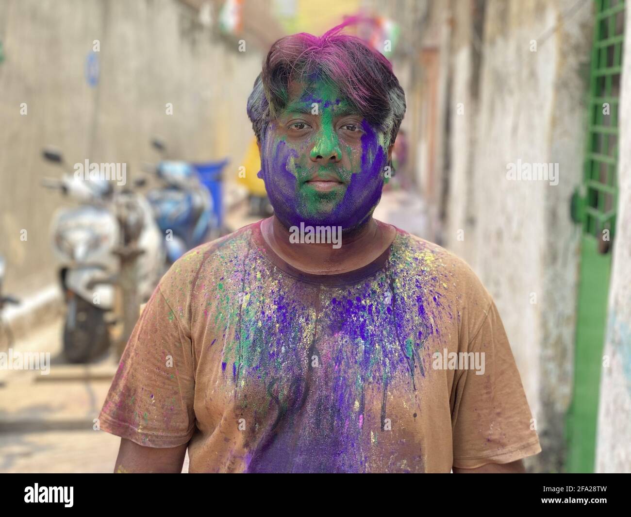 A man with colors in face Stock Photo - Alamy