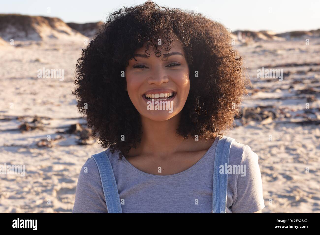 Portrait of african american woman looking at camera and smiling at the ...