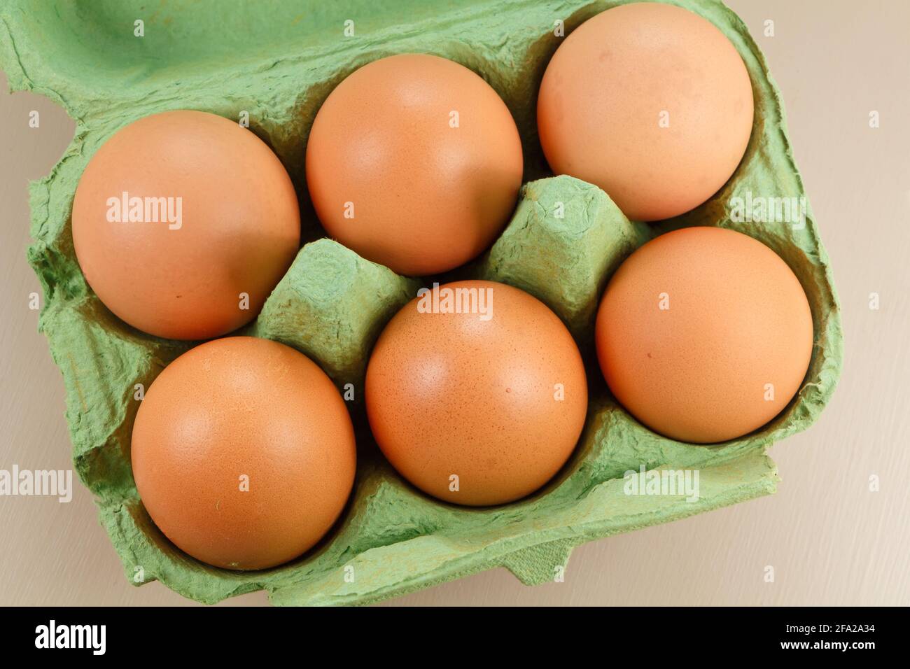 Six fresh eggs in an green egg carton Stock Photo - Alamy