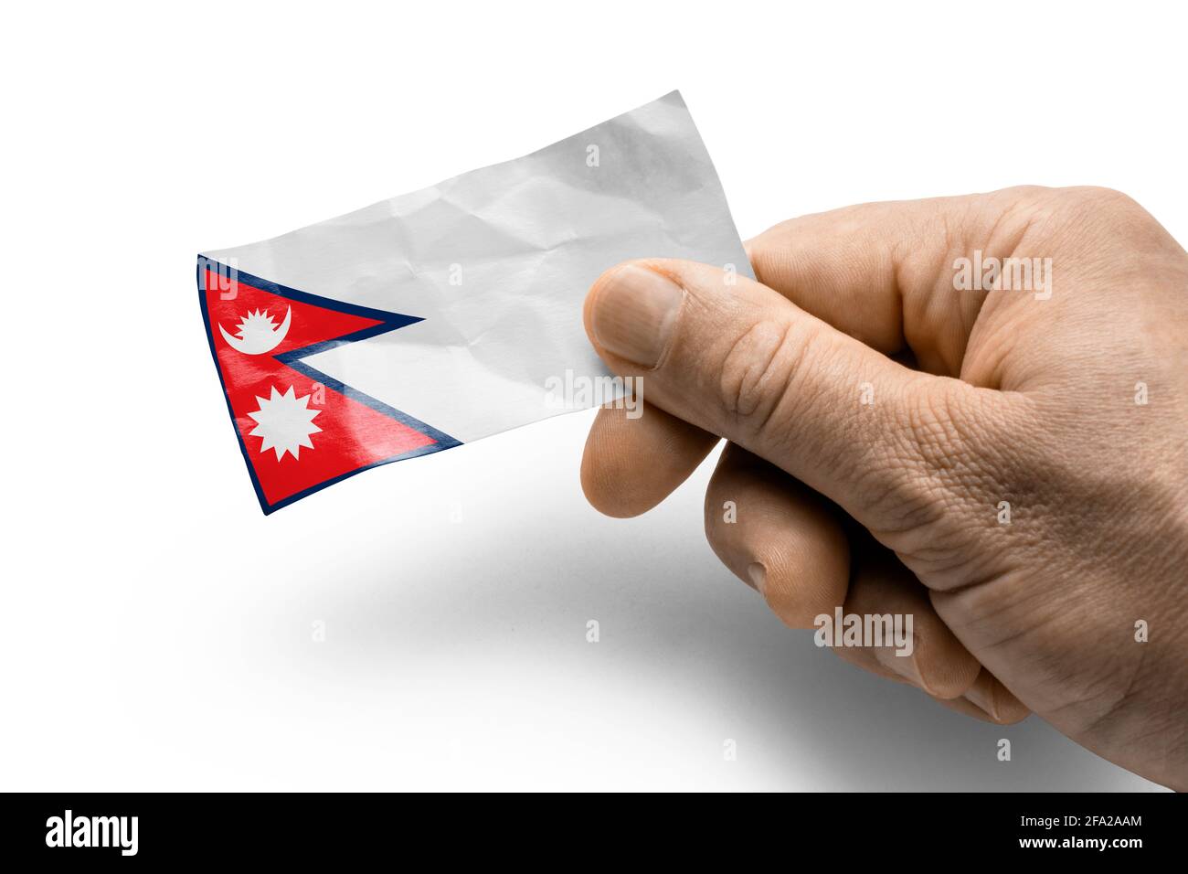 Hand holding a card with a national flag the Nepal Stock Photo - Alamy