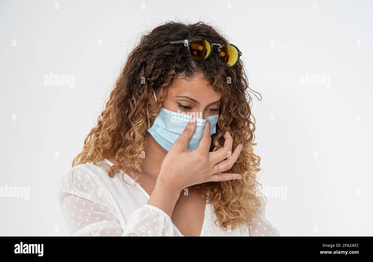 England, UK. 2021. Woman wearing a face mask during Covid-19 outbreak ...