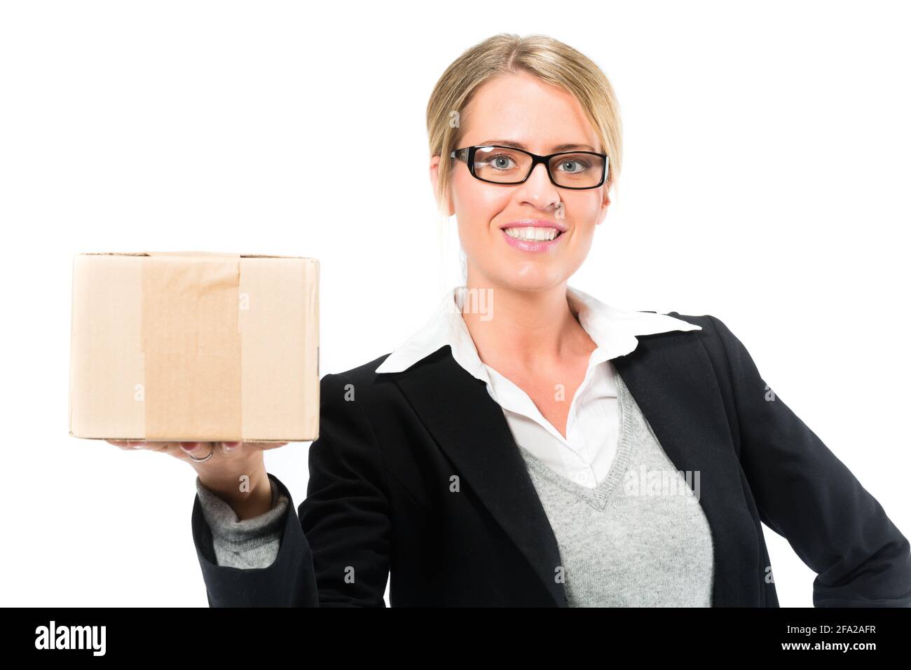 Young woman in front of white background, she ship a package or would ...