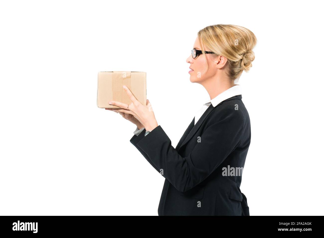 Young woman in front of white background, she ship a package or would ...