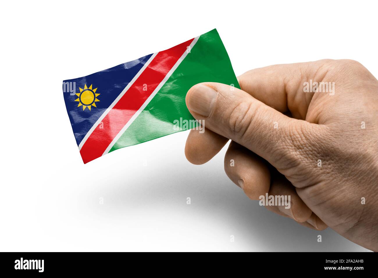 Hand holding a card with a national flag the Namibia Stock Photo - Alamy