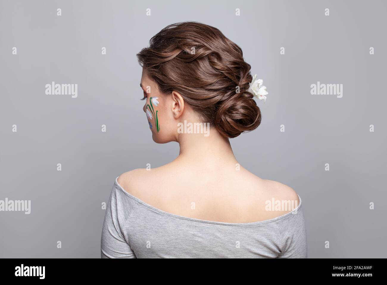 Pretty brunette woman back and head with perfect hairdo on white ...