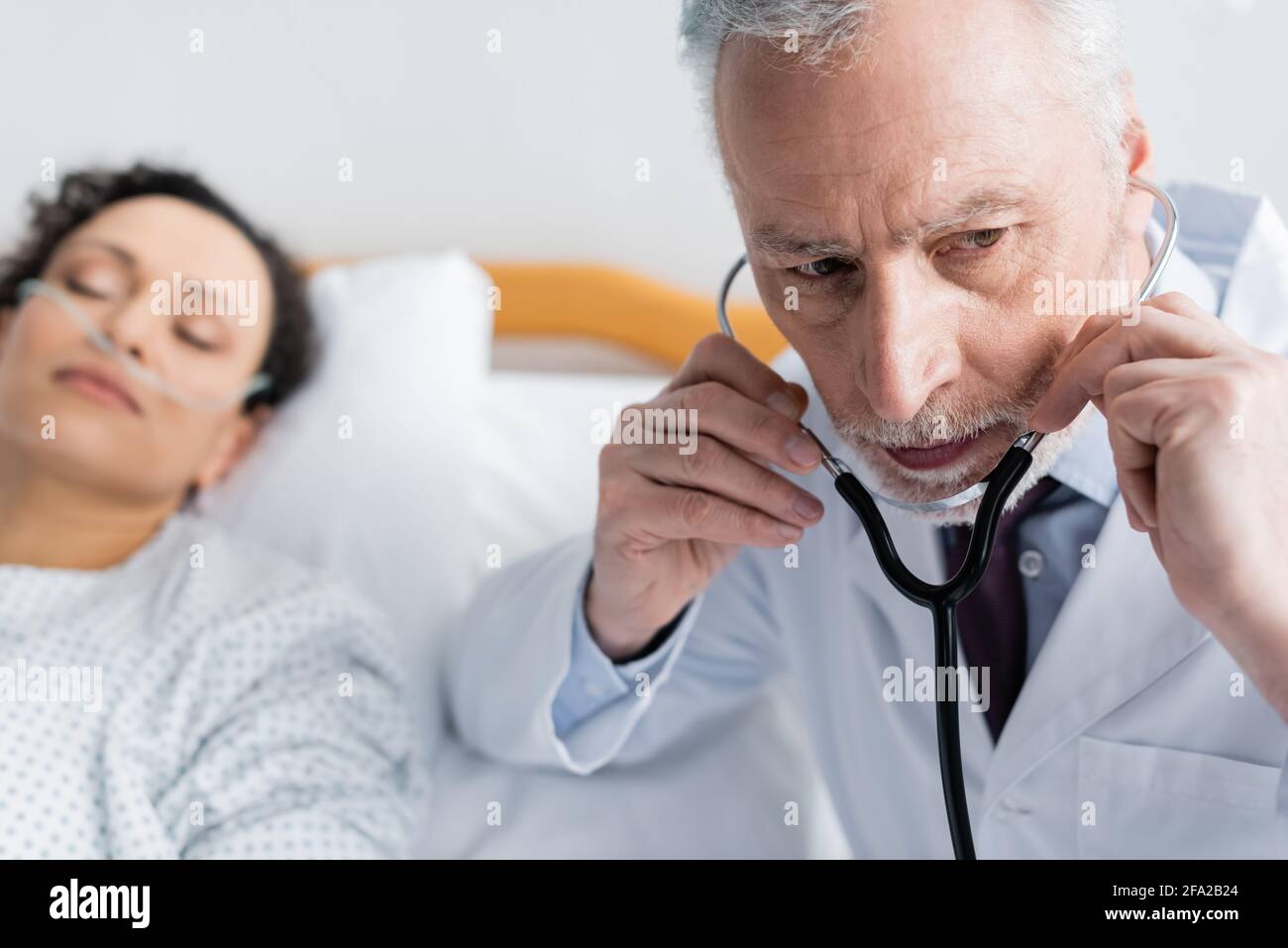 Doctor in blur background putting hi-res stock photography and images ...