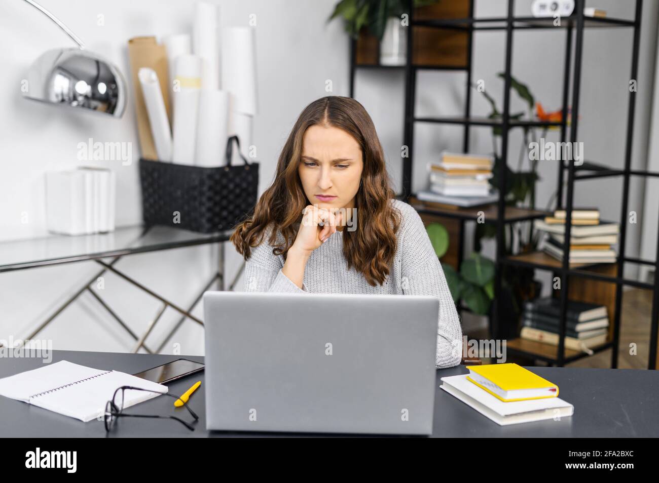 Carefully looking at screen hi-res stock photography and images - Alamy