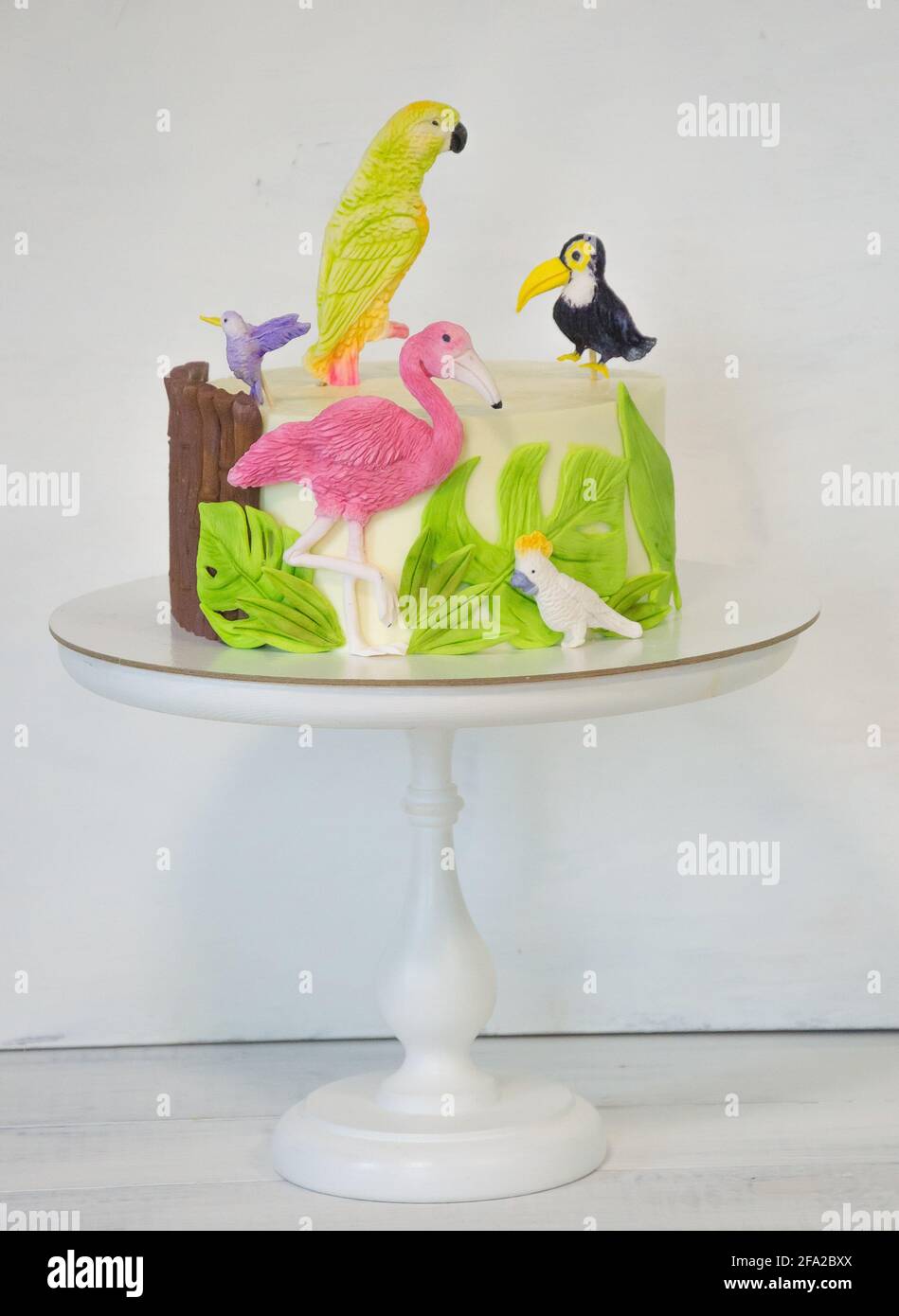 Fantastic tropical fondant cake with flamingo and a parrot Stock Photo ...