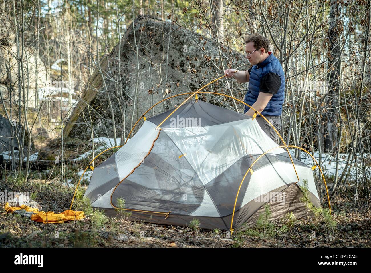 Tourist man setting camping tent hi-res stock photography and images ...
