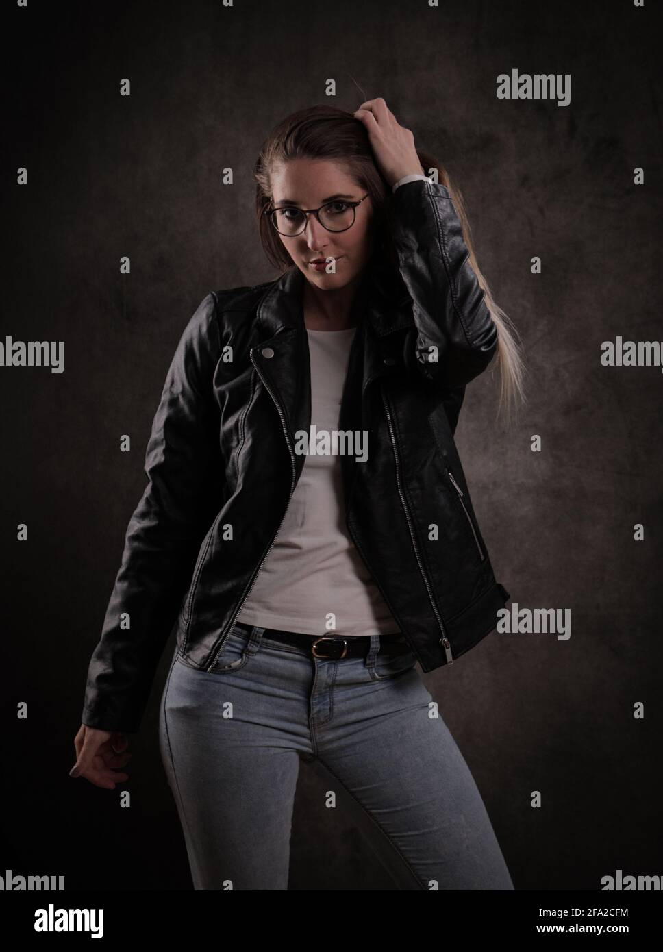 Attractive young woman poses for the camera Stock Photo - Alamy