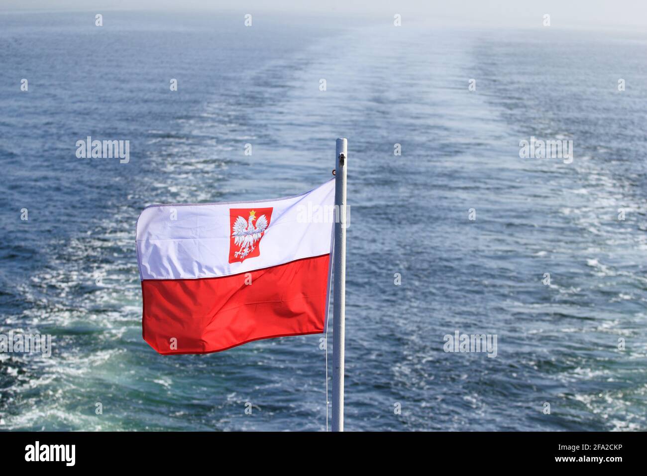 Polish flag waving while sailing on a yacht in the sea Stock Photo - Alamy