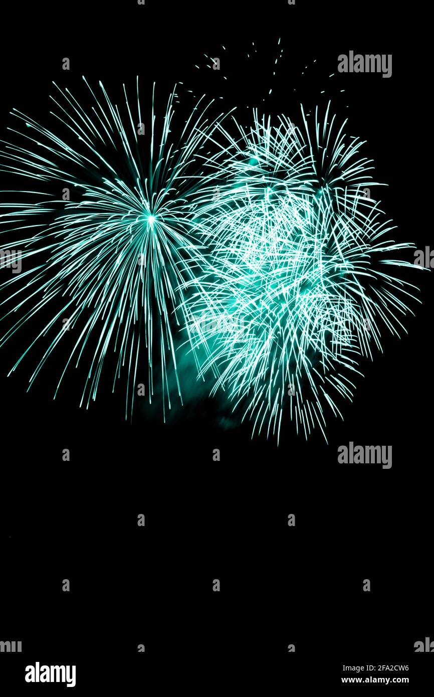 Luxury fireworks event sky show with turquoise big bang stars. Premium ...