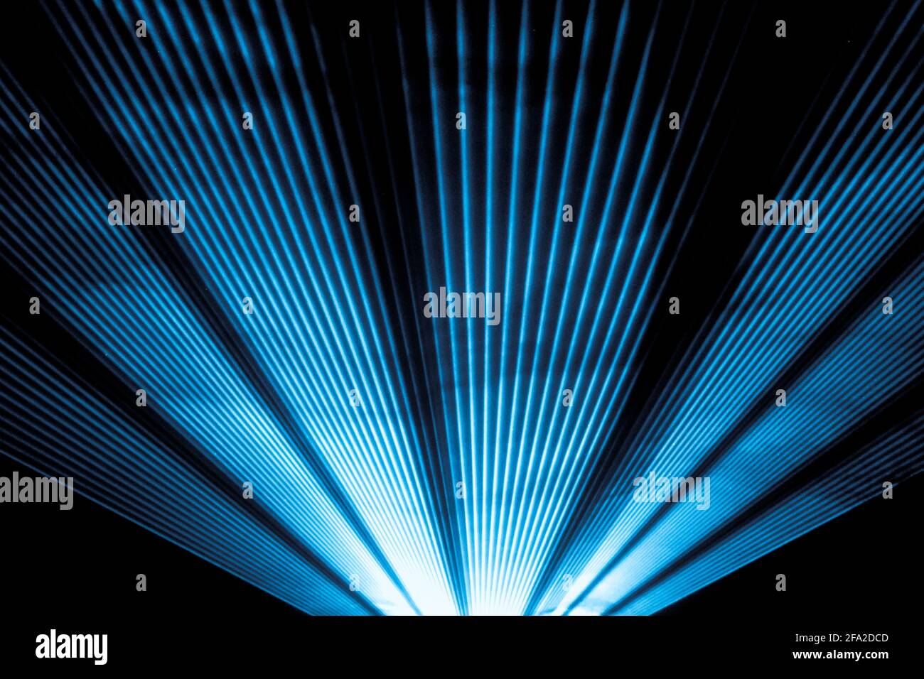 Blue laser show nightlife club stage and shining sparkling rays. Luxury ...