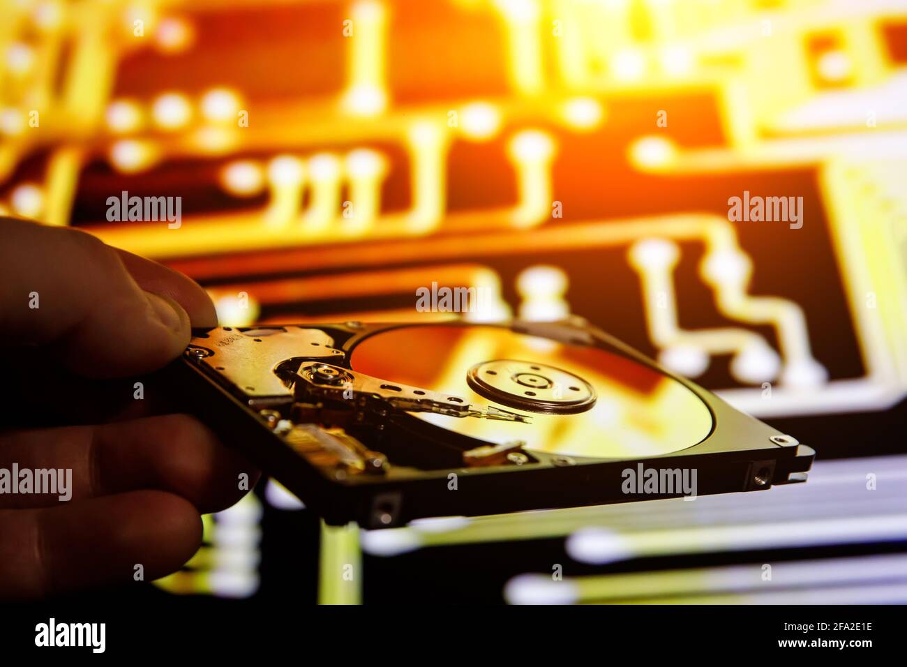 Close up of hardisk internal mechanism hardware. HDD in hand Stock ...