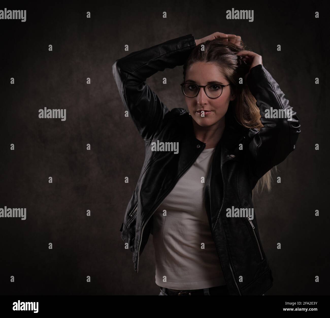 Attractive young woman poses for the camera Stock Photo - Alamy