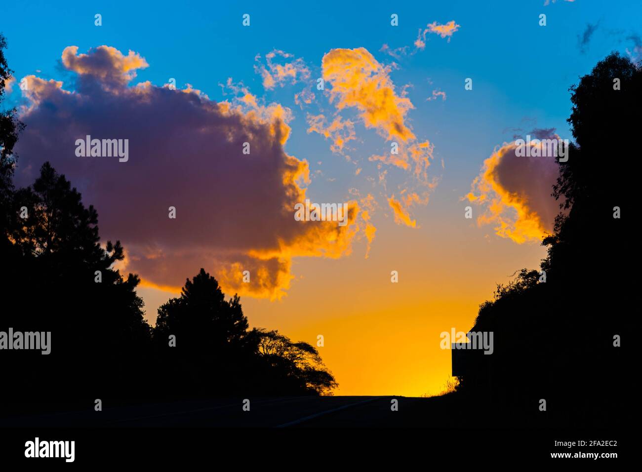 Dramatic sky and silhouettes at dusk in southern Brazil. Sunset with ...