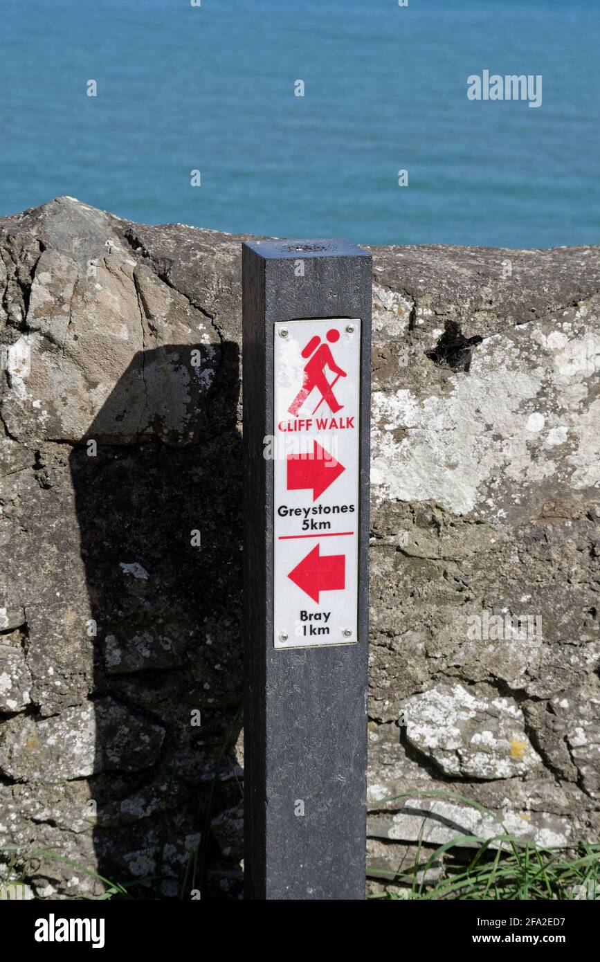 Vertical shot of the sign with cliff walk distances Stock Photo - Alamy