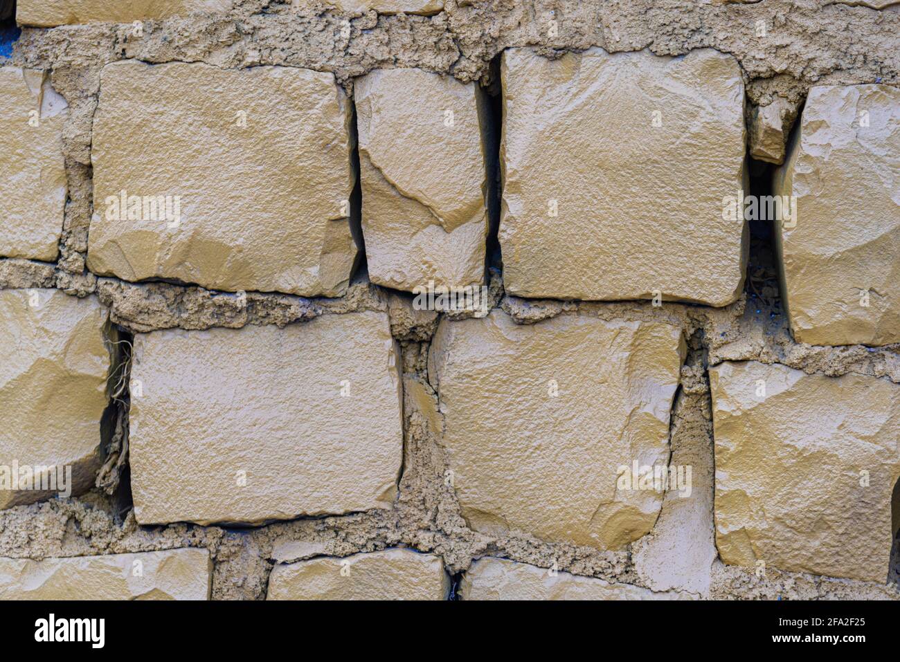 Urban retaining wall built with basalt stones. Rock wall of basaltic ...