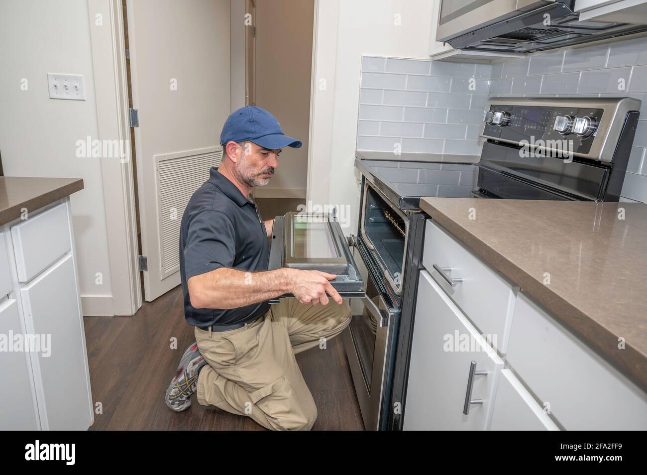 Technician installing hi-res stock photography and images - Alamy