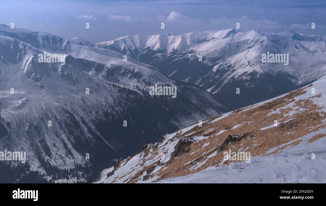 Amazing visual travel into winter mountains Stock Photo - Alamy