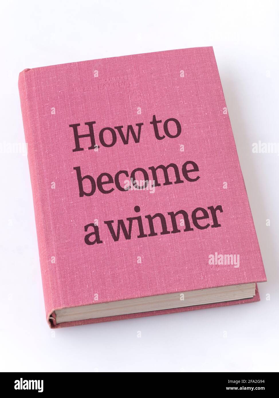 how to become a winner phrase printed on textile book cover Stock Photo ...