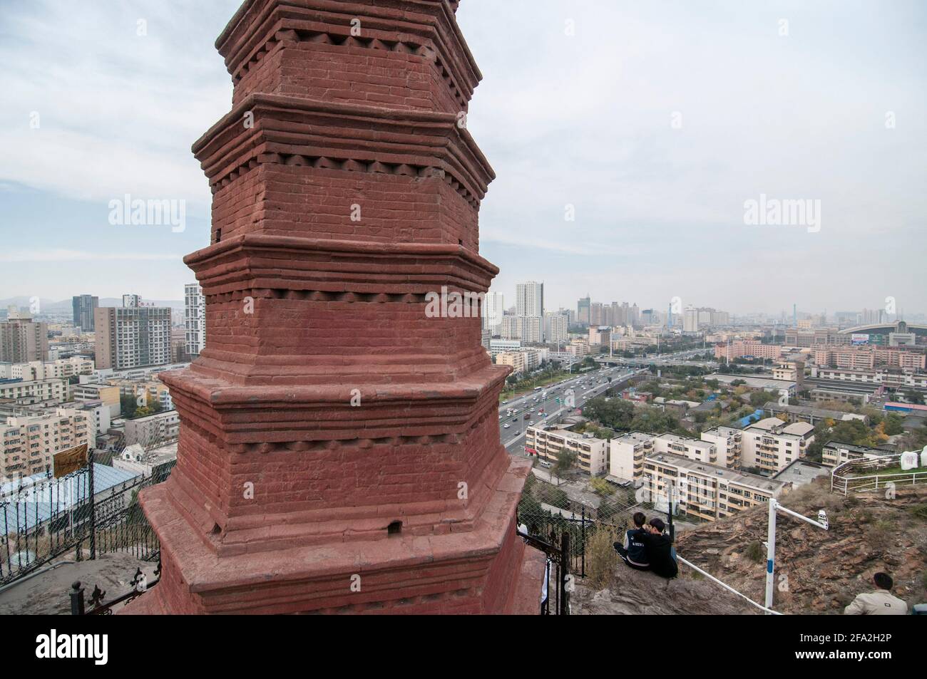 People enjoy a view from the park where the pagoda stands on Hongshan ...