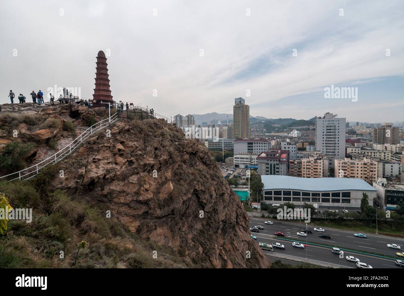 People enjoy a view from the park where the pagoda stands on Hongshan ...