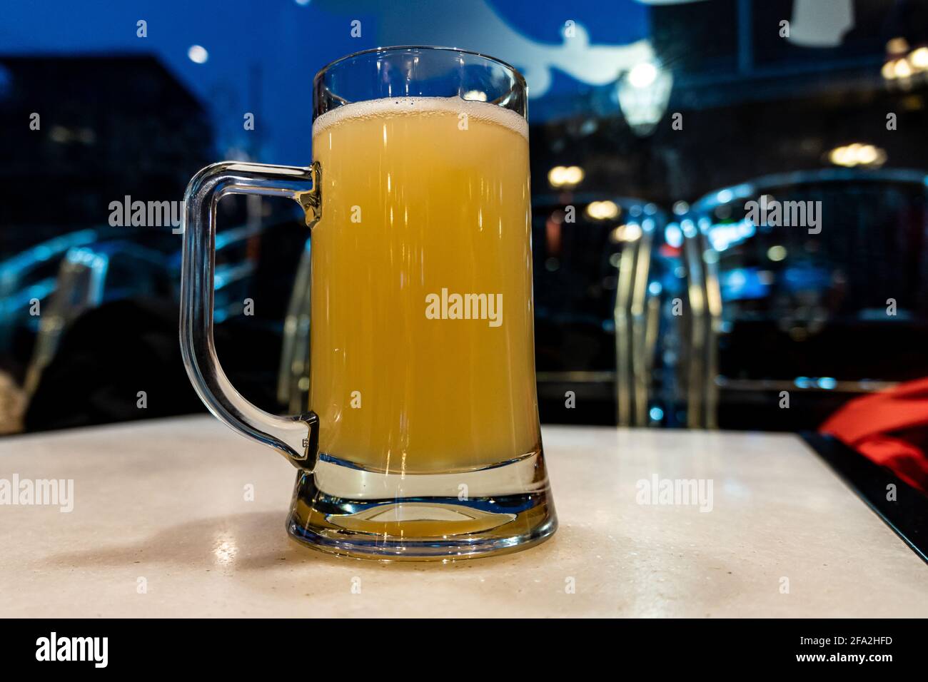Glass of radler (lemon with beer) on blurred background Stock Photo - Alamy