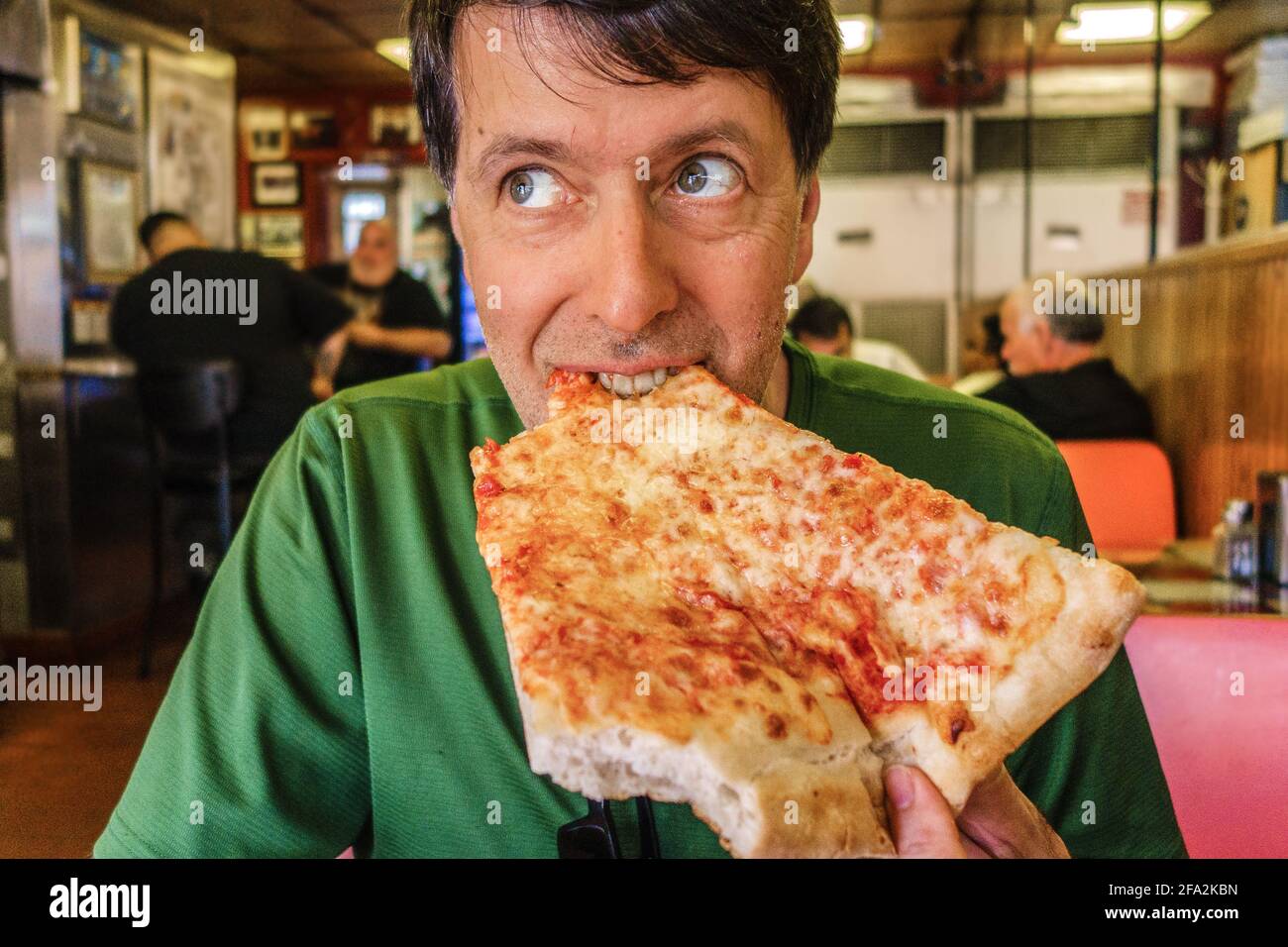 Man eating slice pizza hi-res stock photography and images - Alamy