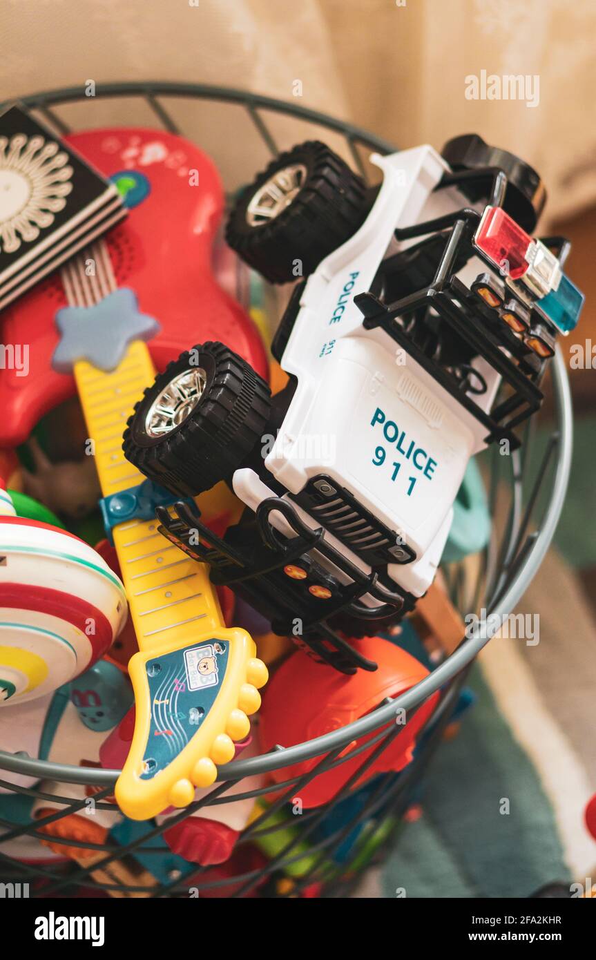 POZNAN, POLAND - Apr 21, 2021: Mix of different toys in a metal bas ...