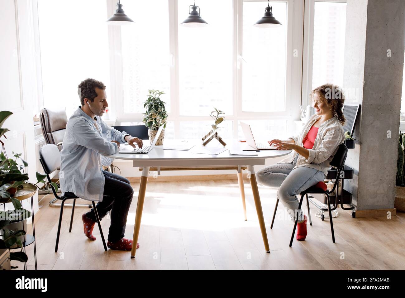 Confident business partners working together on new strategy for the ...