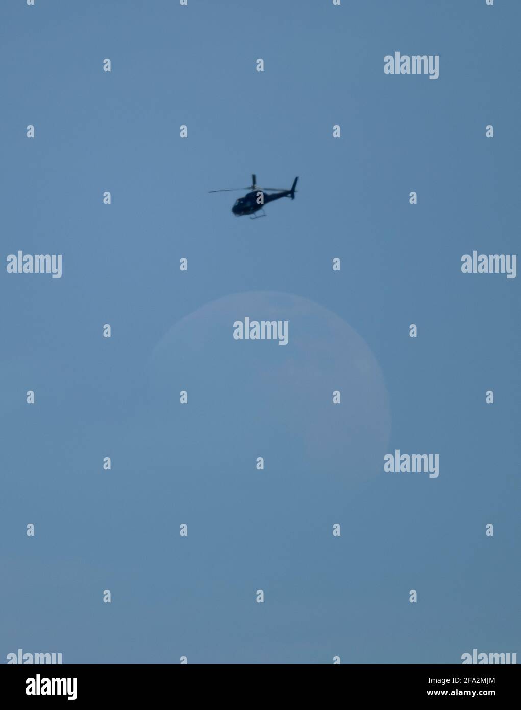 Wimbledon, London, UK. 22 April 2021. A barely visible waxing gibbous ...
