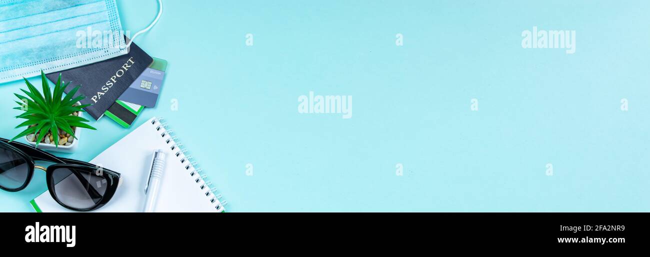 Buying plane tickets during the coronavirus pandemic. Passport, credit ...