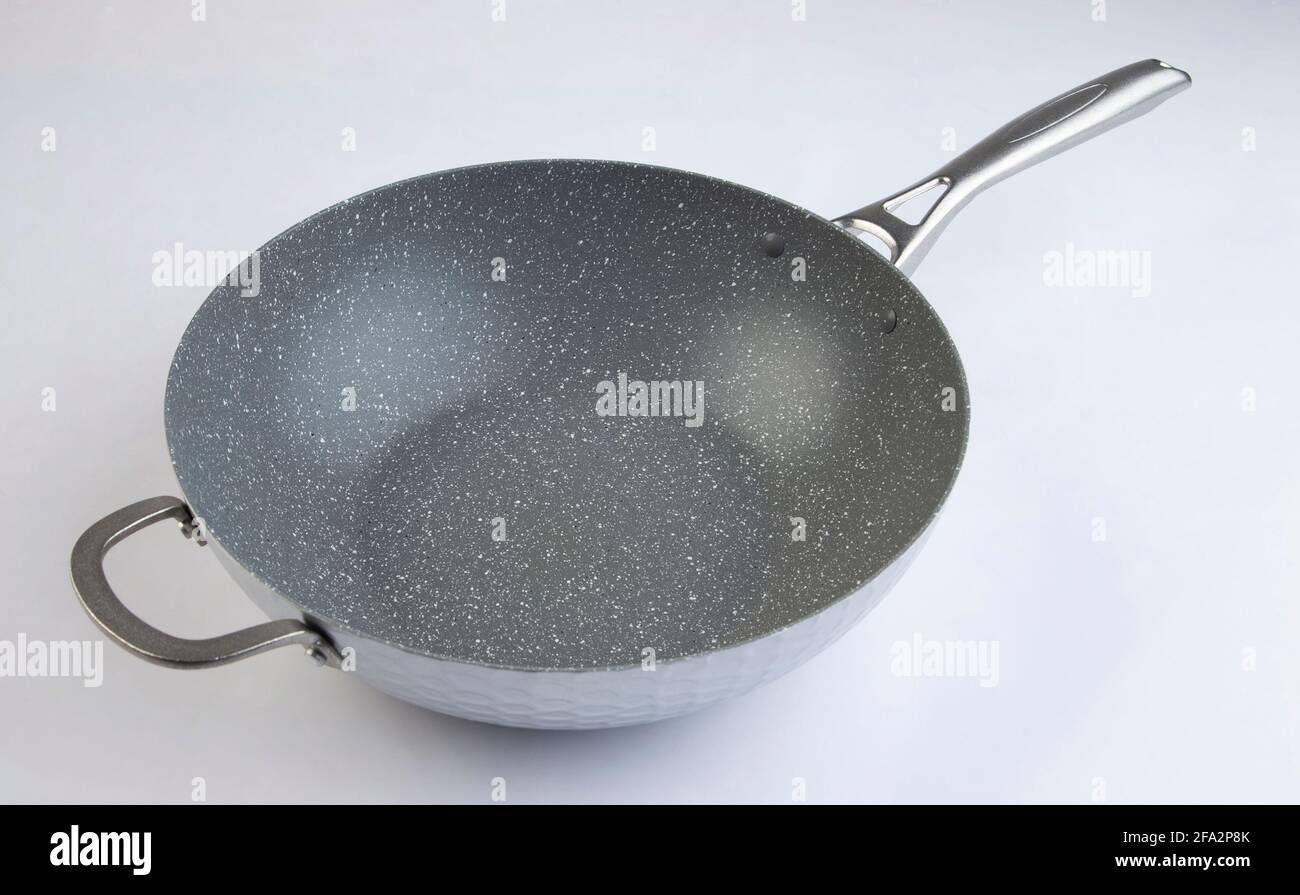 Empty frying metal pan isolated on white background Stock Photo - Alamy