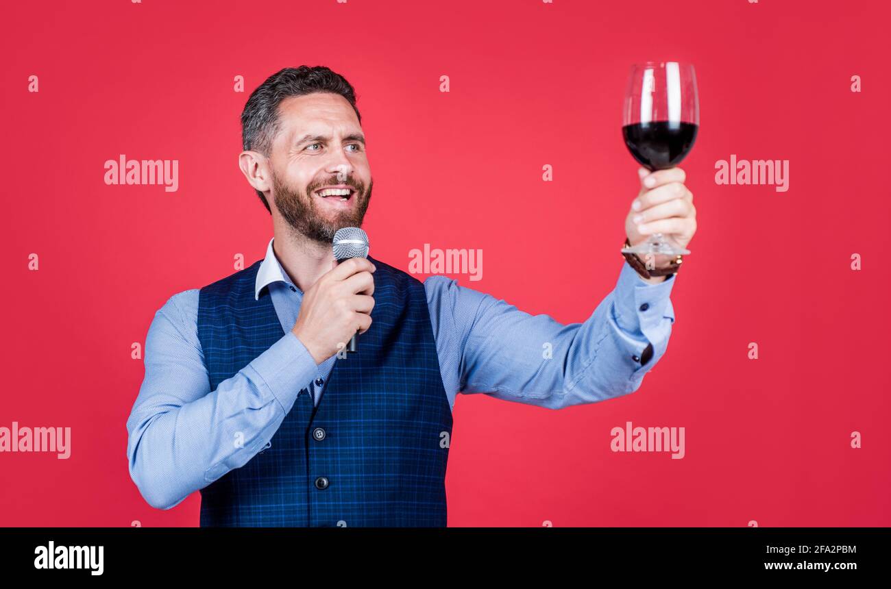 Happy man toastmaster raise glass of wine to propose toast before ...