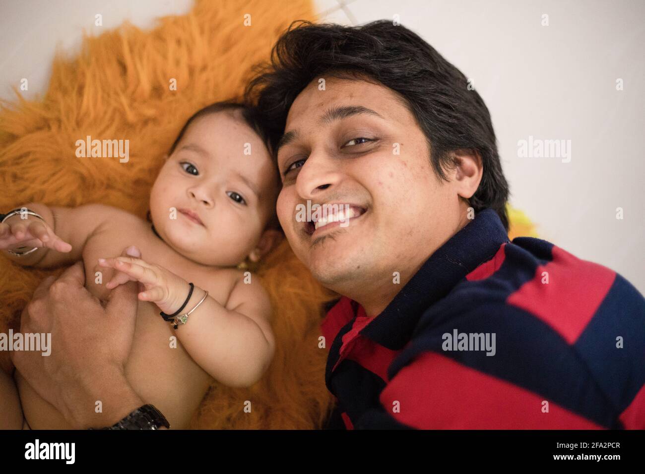 Closeup shot of a cute happy Indian female baby and her father Stock ...
