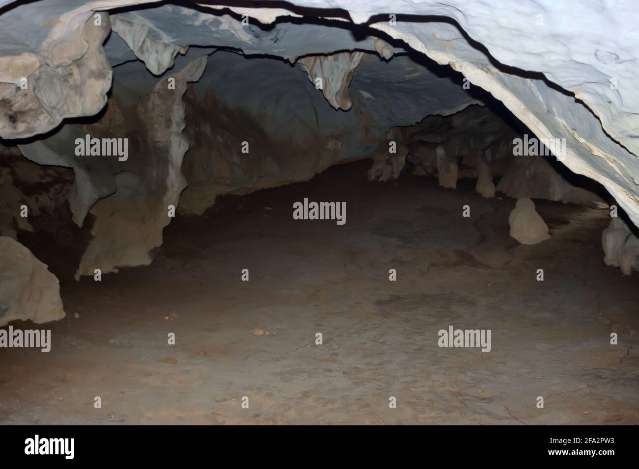 Speleology. Old cave washed by an underground river in the mountain ...