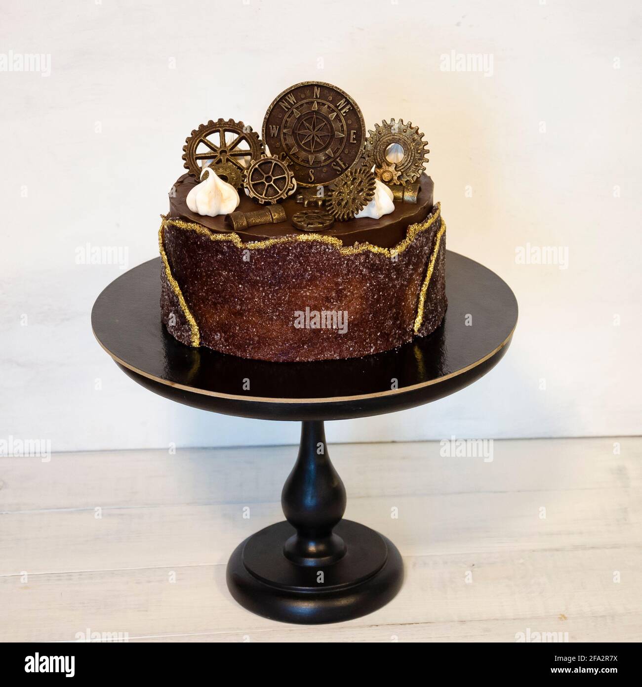 Gorgeous extra chocolate steam punk cake with gilded glaze Stock Photo ...